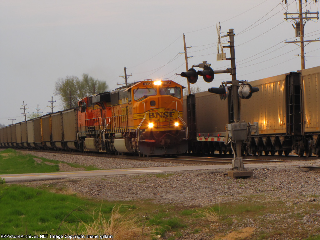 BNSF 9862 leads a sb coal load past a nb empty.